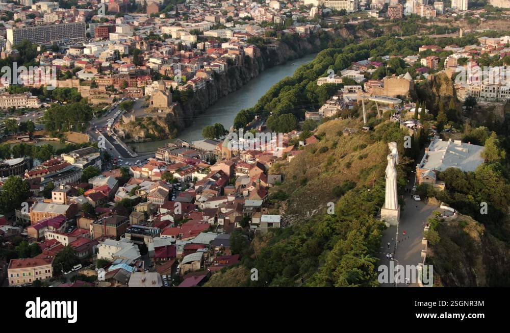 Kartlis Deda (Mother of Georgia) Monument in Tbilisi city, aerial orbit ...