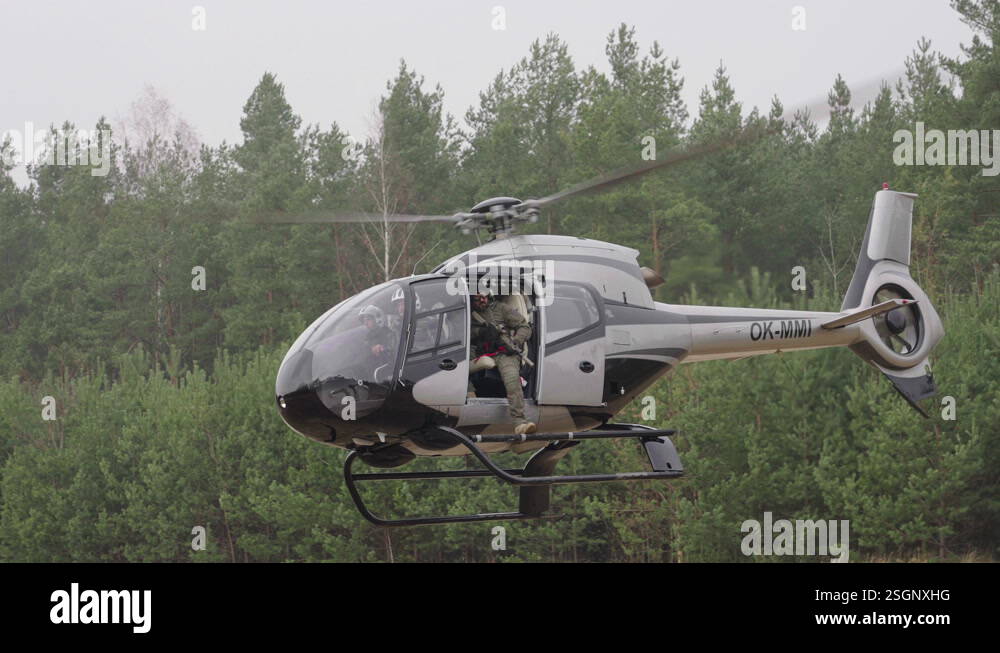Soldier in Military Helicopter Shooting Target With Sniper Rifle Combat ...