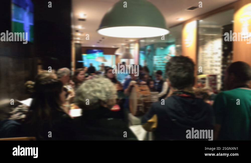 musicians with instruments taking a break in a busy bar with live music ...