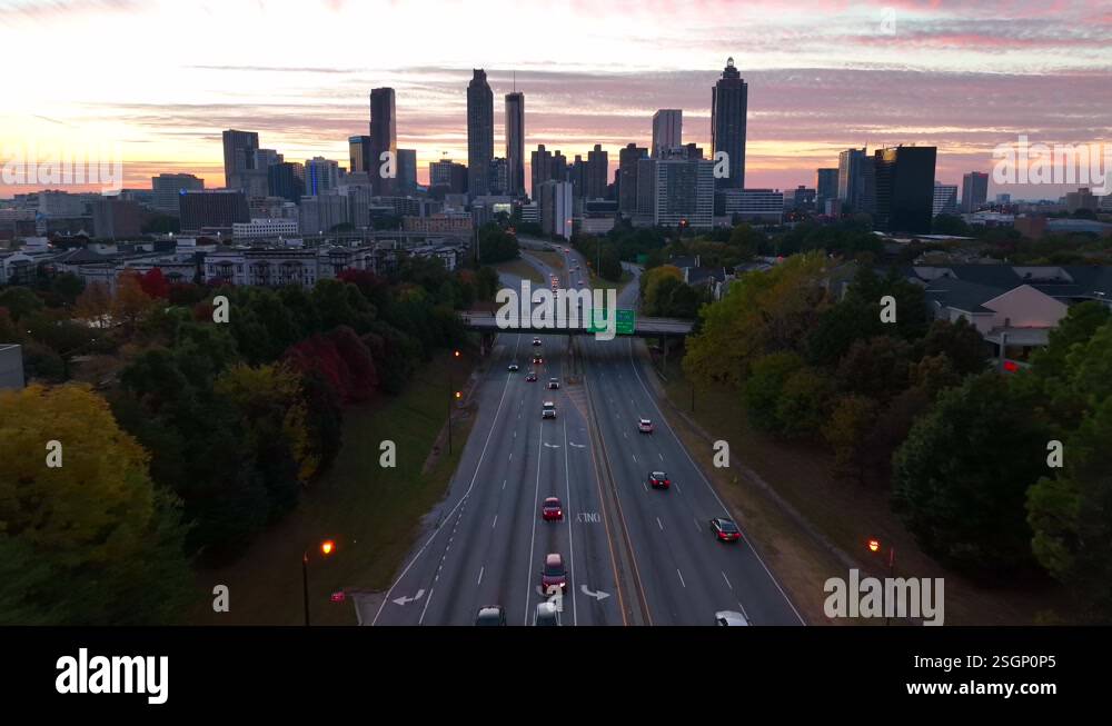 Downtown Atlanta at night. Traffic enters on I-20 interstate during ...