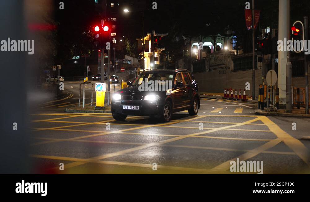 Cars passing red lights at night in the city of Victoria Stock Video Footage - Alamy