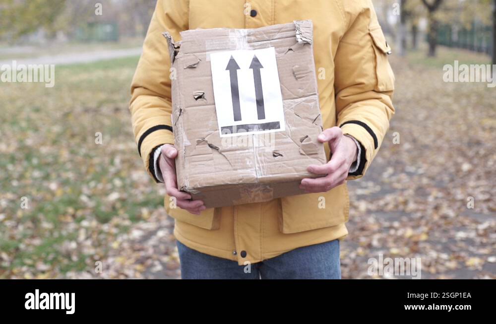 Frightened delivery worker giving broken customer parcel, shipment ...