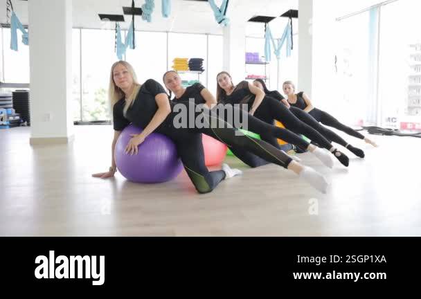 A diverse group of energetic instructors engaging in an enjoyable ...