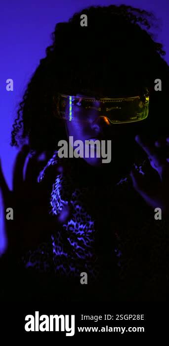 Futuristic illuminated glasses transforming across woman's face ...