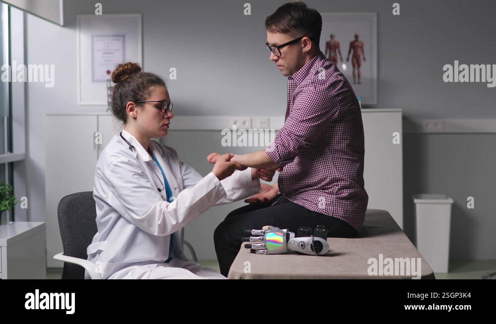 doctor check amputated limb and adjust bionic hand prosthesis to ...