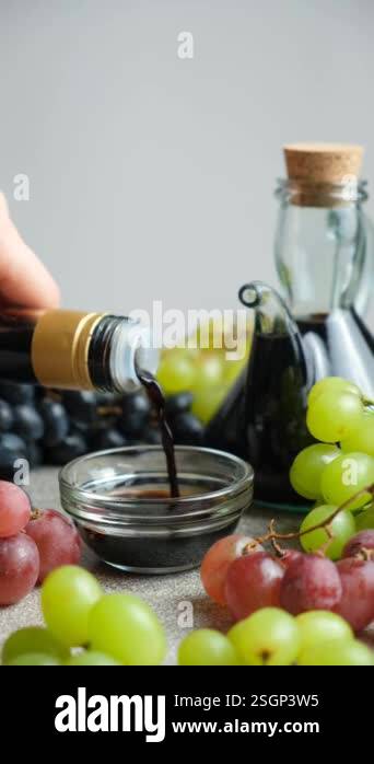 Balsamic vinegar pour from a glass bottle into a bowl Stock Video ...