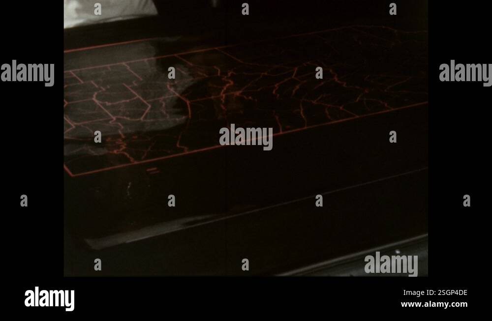 1950s: Man laying down map for reproduction. Map being exposed for ...