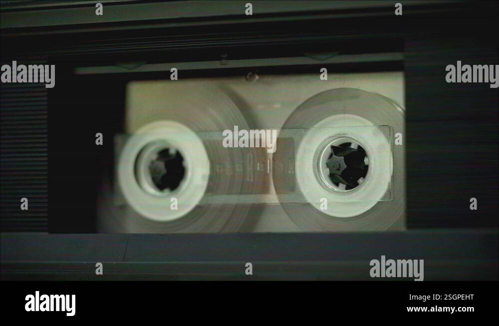 Retro radio tape recorder, audio cassette playing close-up. Listening ...