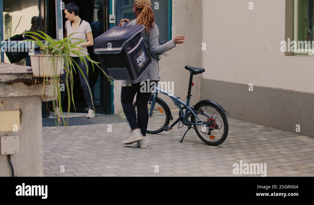 Express food delivery service courier delivering lunch in paper bag ...