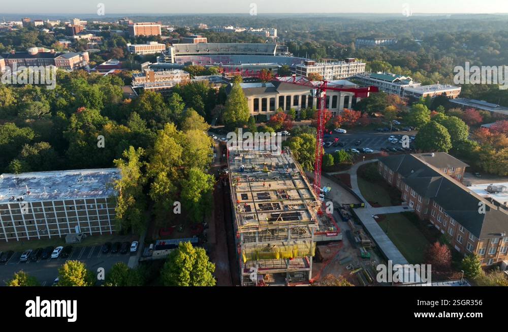 Large building construction project underway at college campus. Aerial ...