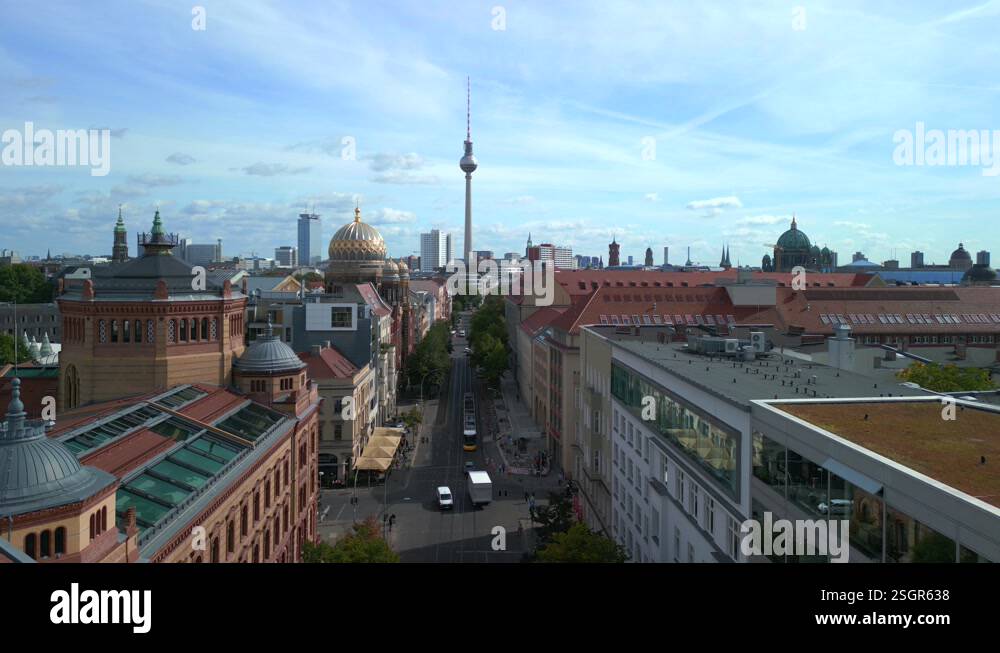 Streetcar cars trucks on street to tower. Magic aerial view flight drop ...
