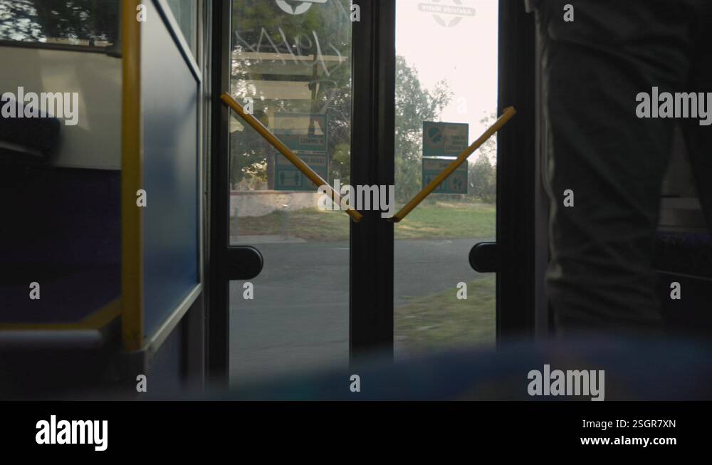 Passenger man on a transit bus Exiting at Stop Stock Video Footage - Alamy