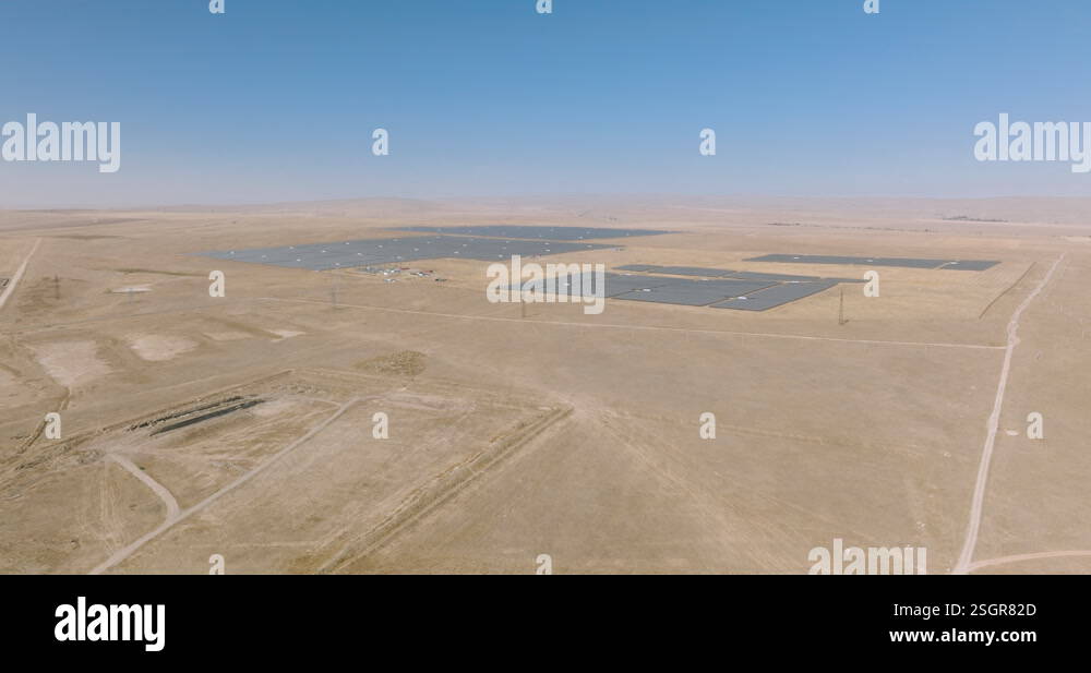 Large Solar station in arid field and plain steppe lanscape, power ...