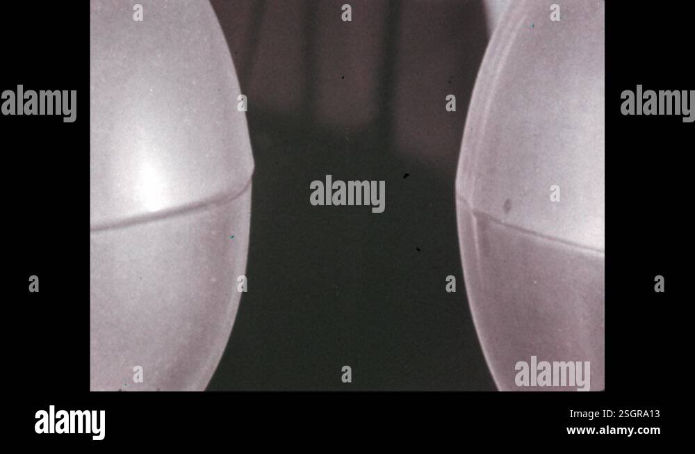 1960s: Two Van de Graff generators spark and react. Positive and ...