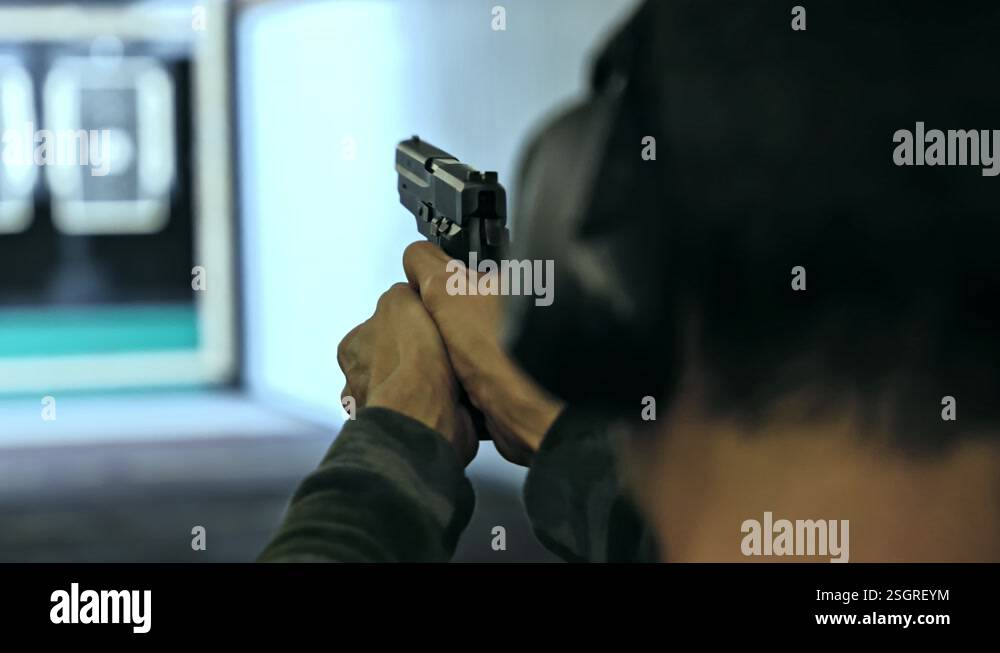 Man Shooting with a Gun in Shooting Range Stock Video Footage - Alamy