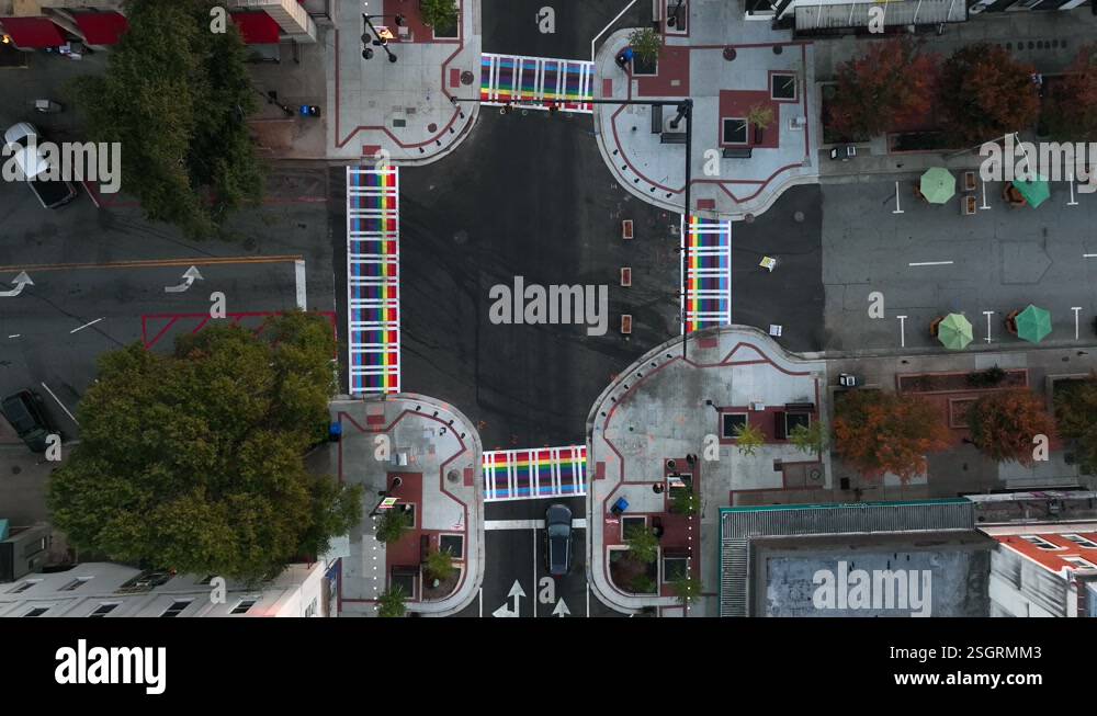 LGBTQ queer theme. Rainbow pride crosswalk pedestrian walkway on street ...