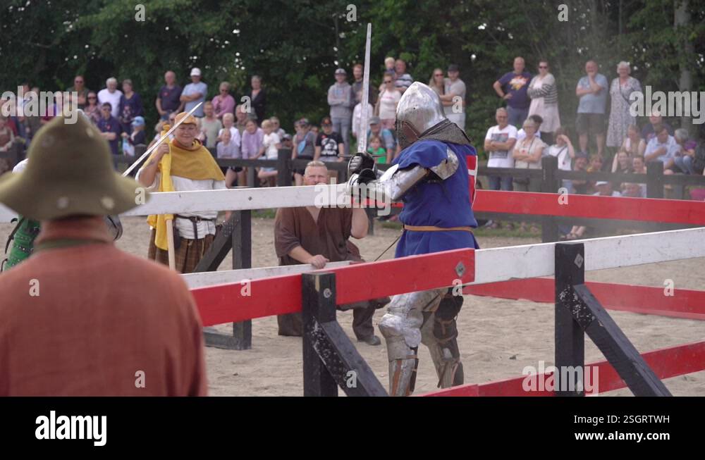 Medieval Knights Fighting With Swords In The Battlefield, Crowd Of ...