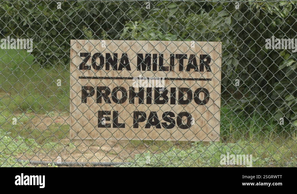 Zona Militar prohibido el paso, Sign frame on a military wire fence Stock Video Footage - Alamy