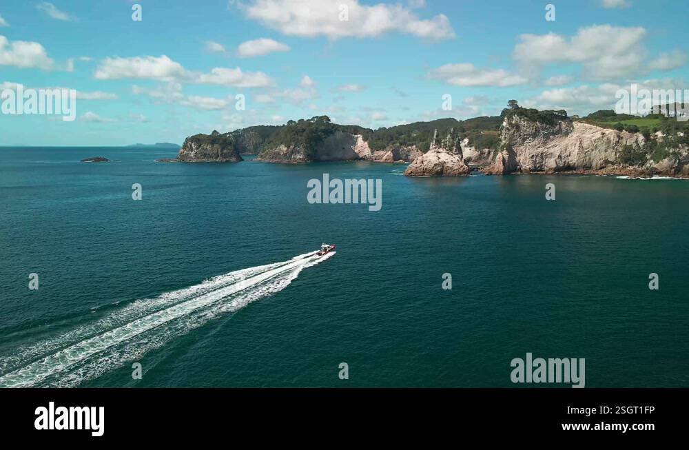Boat visiting secluded islands along the coastline Stock Video Footage ...