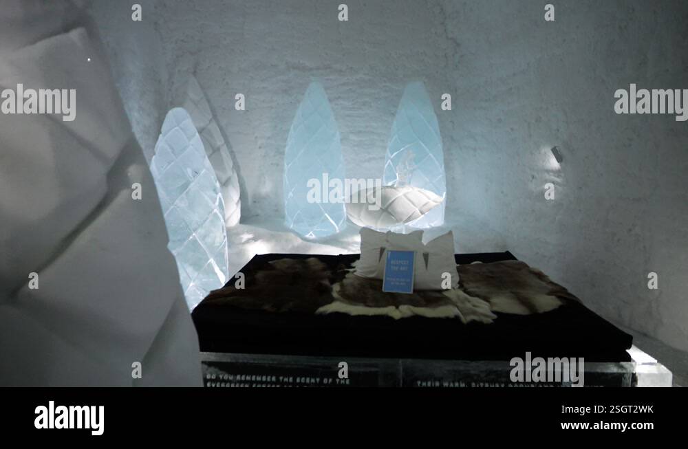 Ice room with bed and ice sculptures in Ice Hotel in Scandinavia ...