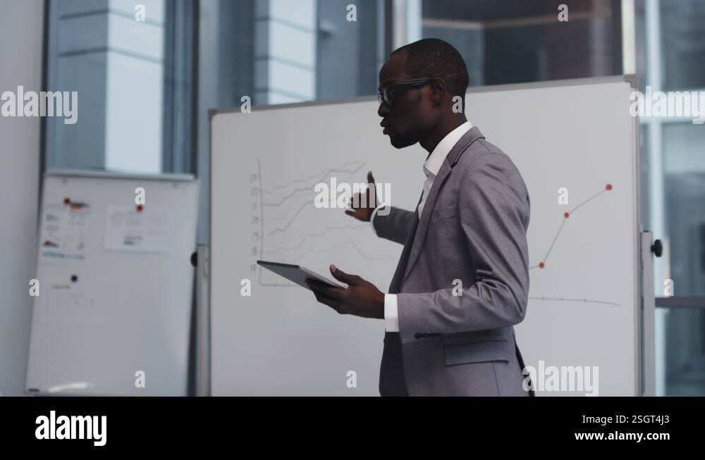 Black Manager Demonstrating Survey Results Stock Video Footage - Alamy