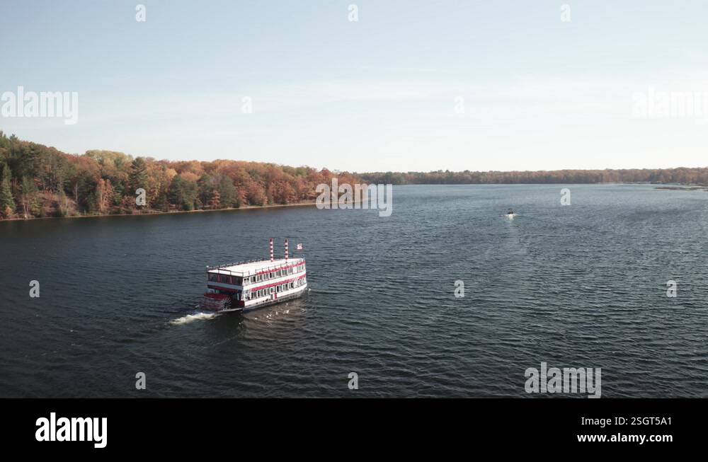 Au Sable River Queen boat on the Au Sable River in Michigan with drone ...