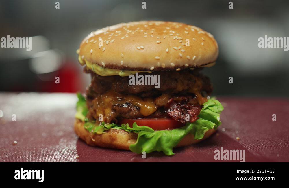 Fast food, view of a cooked burger, the process of cooking a double ...