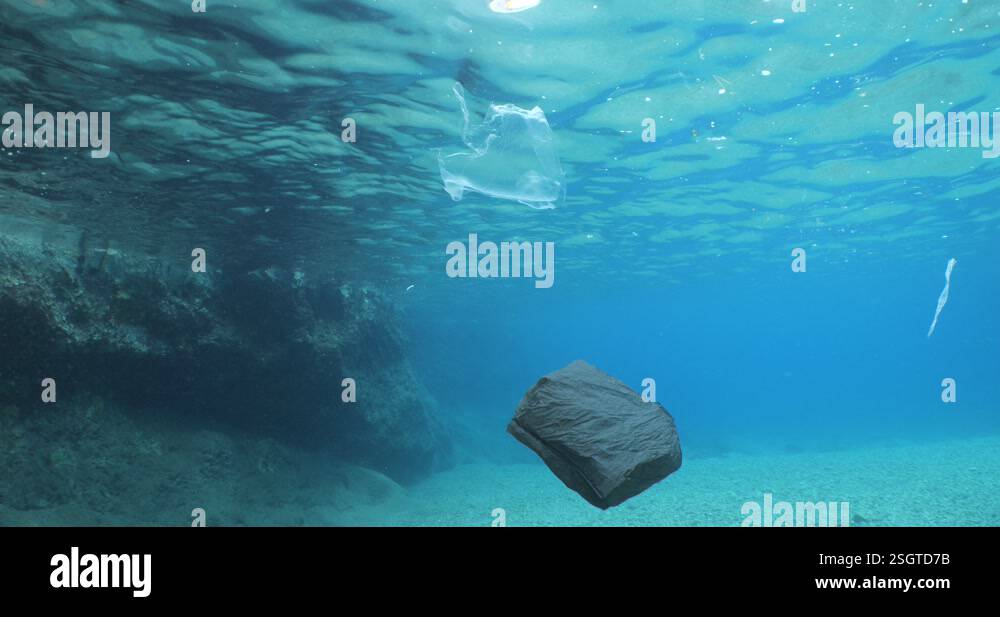 plastic bag underwater bad for fish with sun rays background ocean ...
