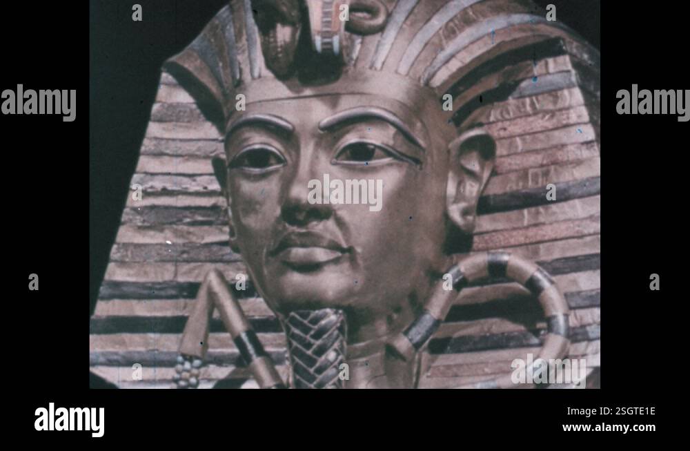 1960s: Statue of Egyptian Pharaoh. Hieroglyphics on stone monument ...