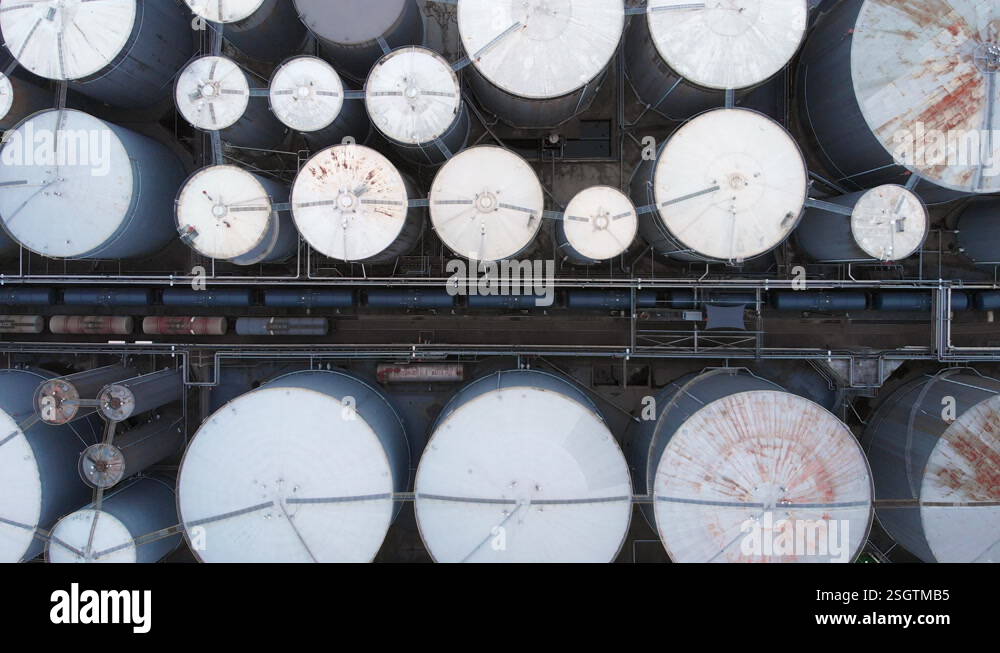 Passing above fuel storage tanks in 30fps 4k Stock Video Footage - Alamy