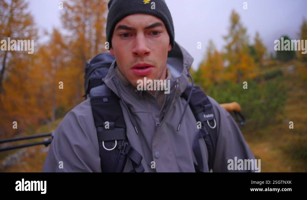 Mountains and forest in Alps, Italian Dolomites with a man running down ...