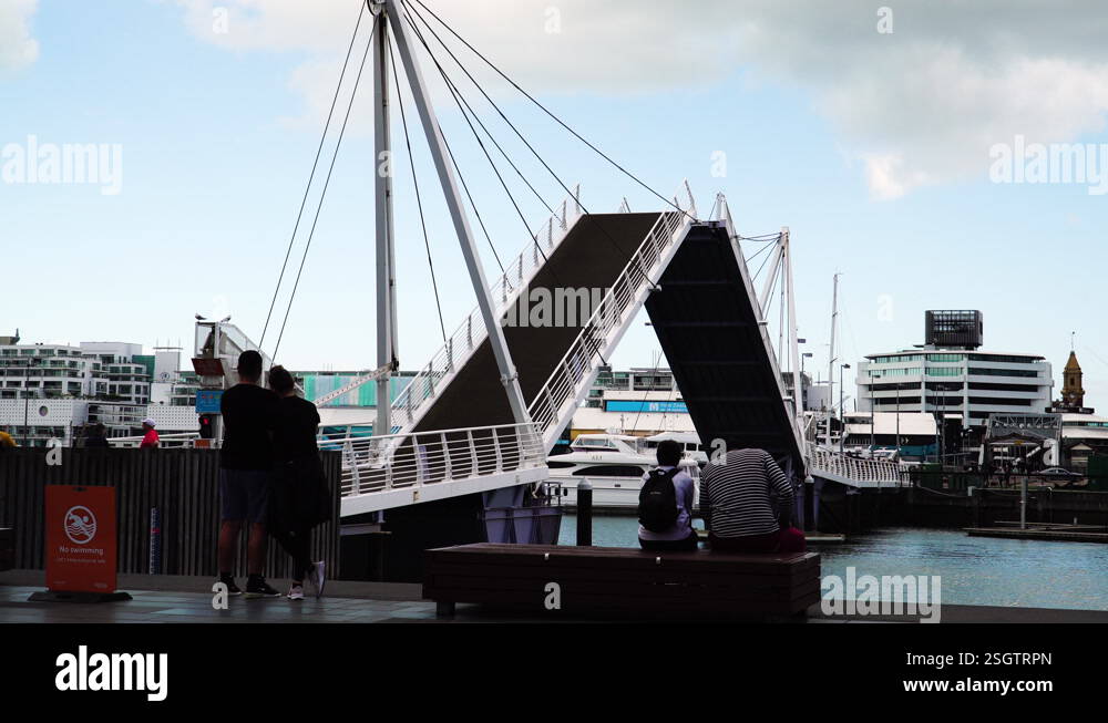 Wynyard Bridge lifting up in Auckland, New Zealand. Tourist walk around ...
