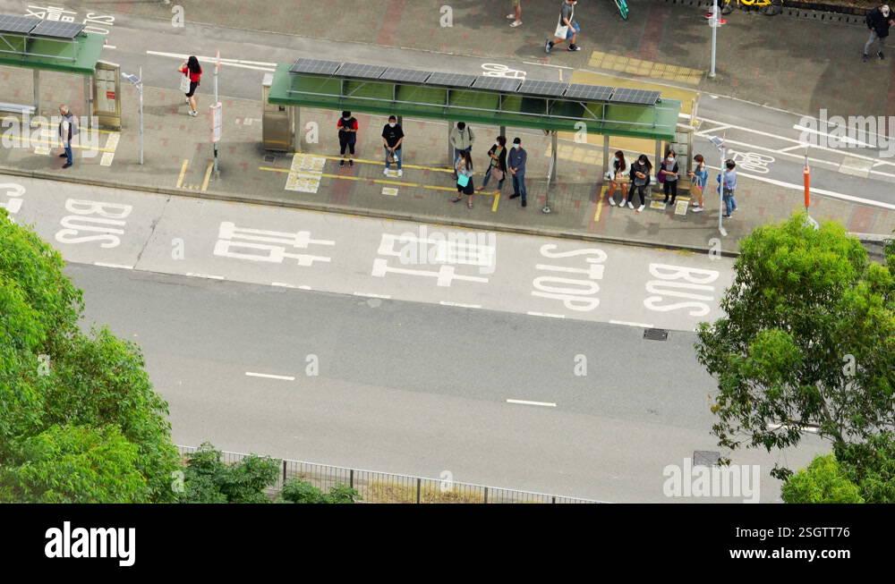 People waiting for the bus at the bus stop. transportation system in ...