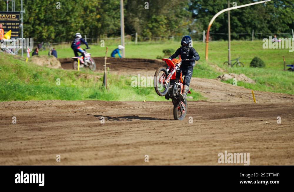 Stunt Racer Man Wheelstand on Motocross Bike, Shows Off Acrobatic Trick ...