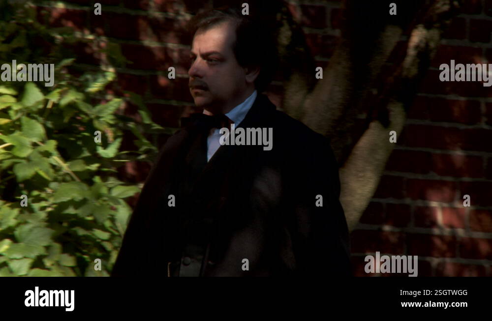 Author Edgar Allen Poe walking through a garden - Actor portrayal Stock ...