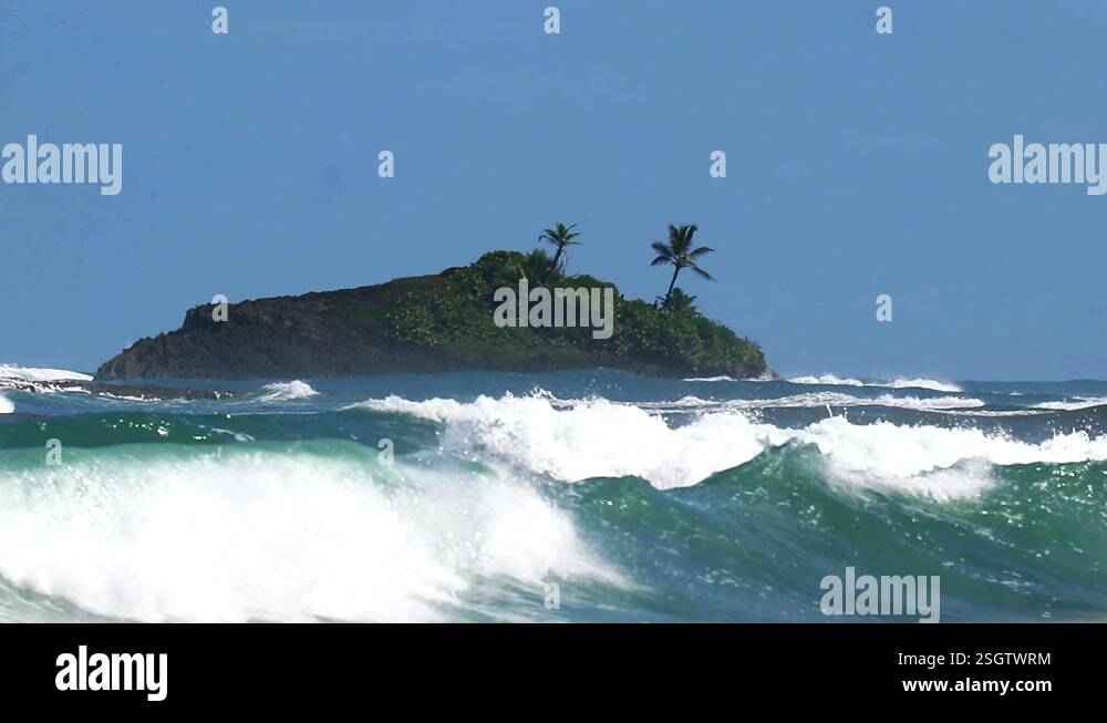 PUERTO RICO- View of a Small Island with Big Waves on the Shore Stock ...