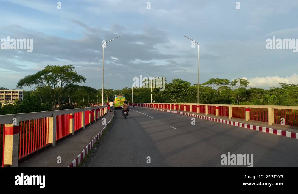 Following a tour but as it crosses a bridge as two rickshaws come the ...
