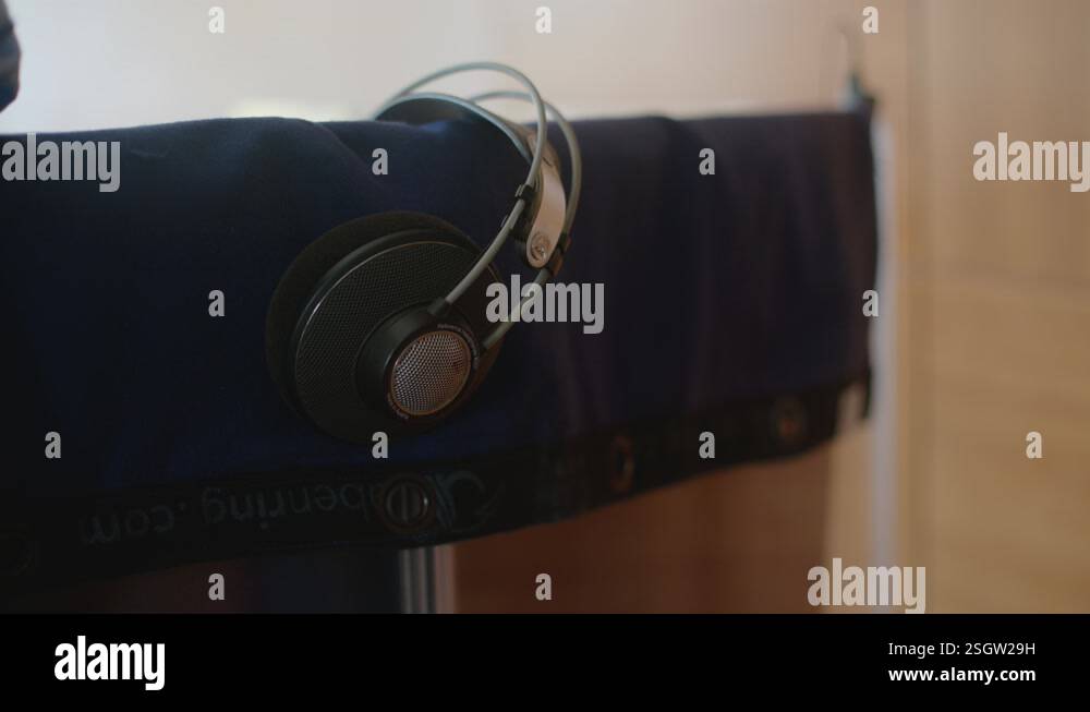 Over ear studio headphones on an audio shield with a blanket in a Stock ...