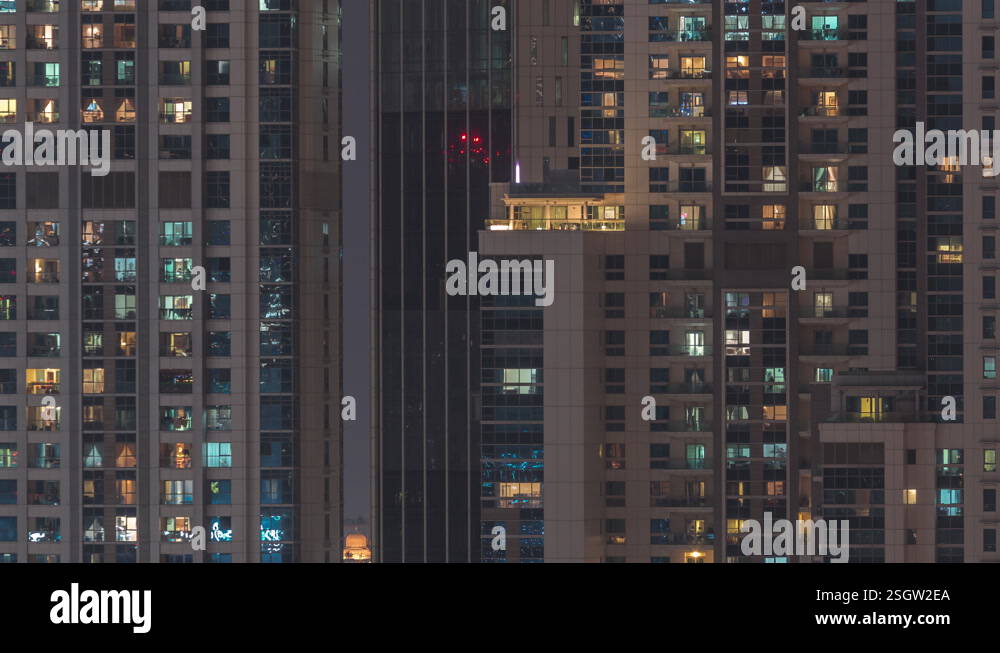 Windows in high-rise building exterior in the late evening with ...