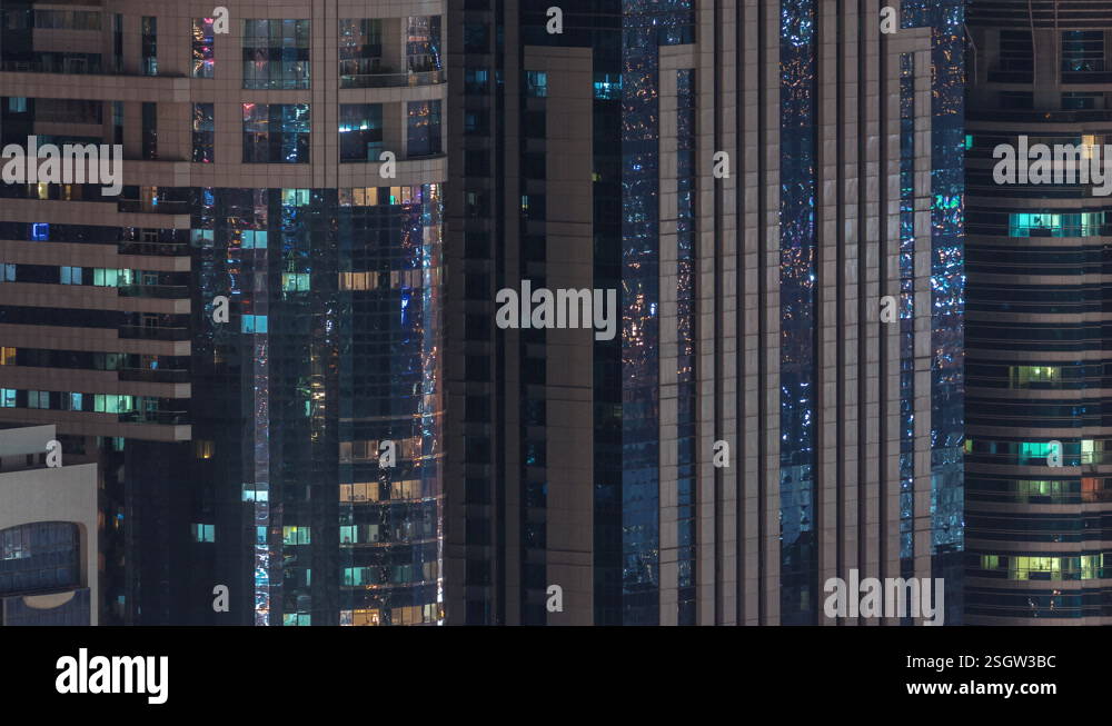 Windows in high-rise building exterior in the late evening with ...