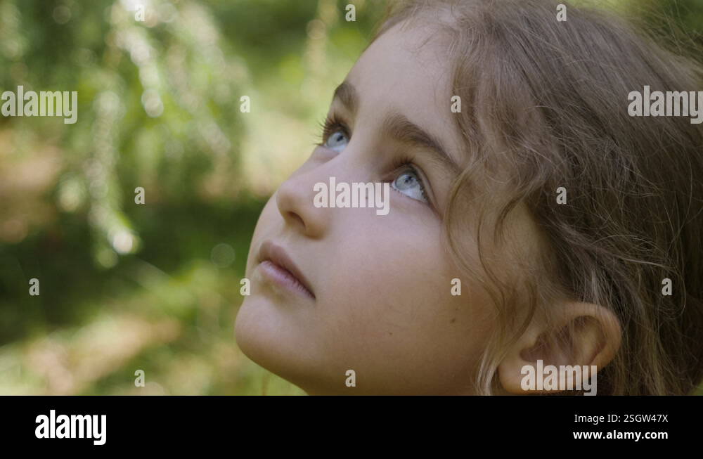 Kid Looking Up at Sky in Nature. Portrait Little Girl Praying Looking ...