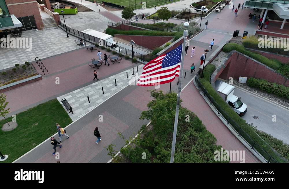 American college campus with USA flags. University school setting ...