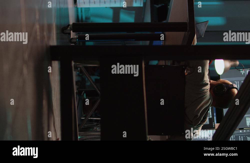 Vertical video: Young programmer with disability typing source code on terminal Stock Video ...