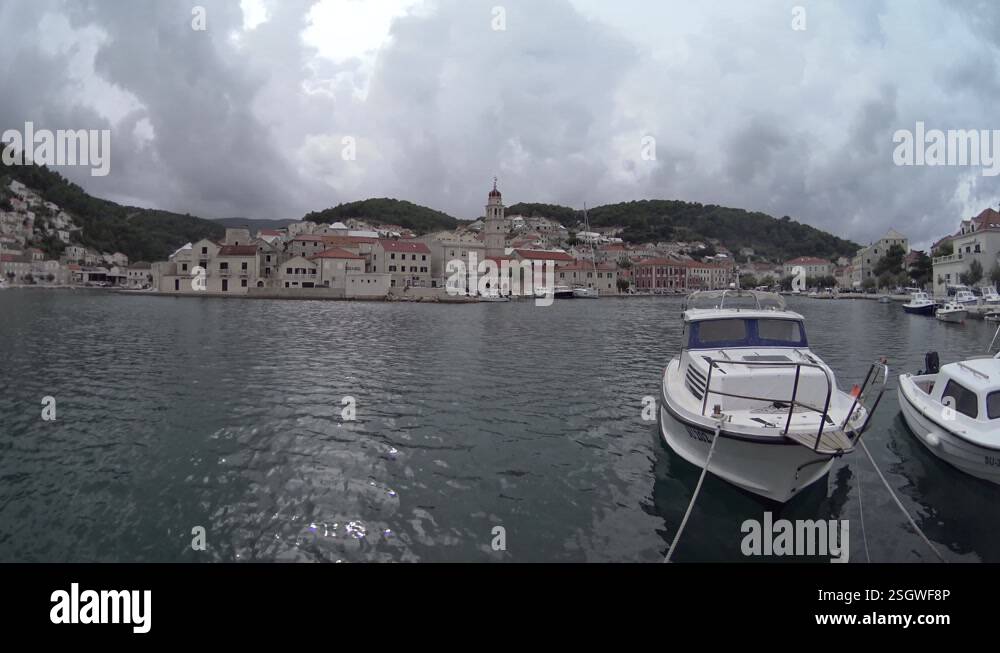 Brac Island, Croatia. Traditional fishing boat in the port. View of the ...