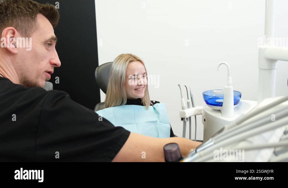 A positive female patient in a dental clinic during a visit to the ...