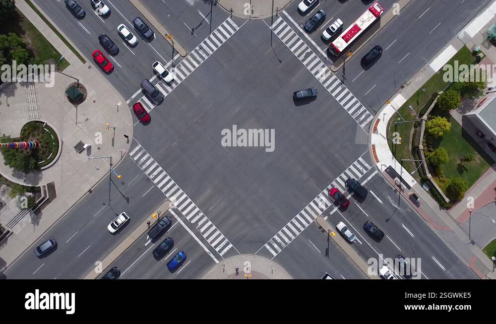 City intersection top down view of cars, public transit buses and ...