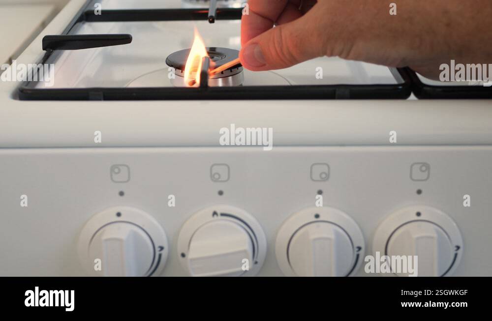 Man Trying to Light Up Fire at a Defective Gas Cooker Using Matches ...