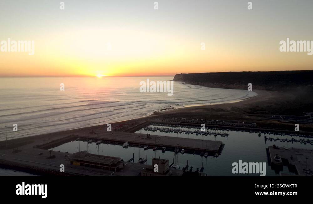 Slow flyover of a busy sea fishing port during sunset Stock Video ...
