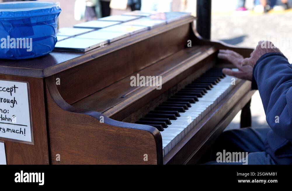 Homeless old guy playing on a wood piano in Seattle streets at Pike ...