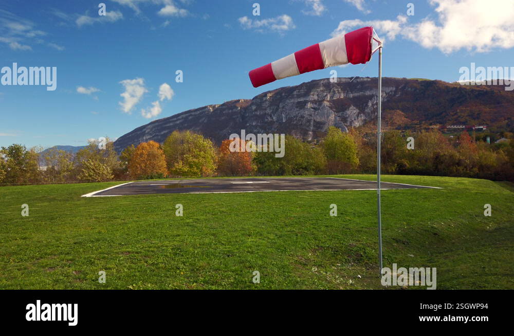 Windsock moving in the wind next to an helipad in 4k Stock Video ...